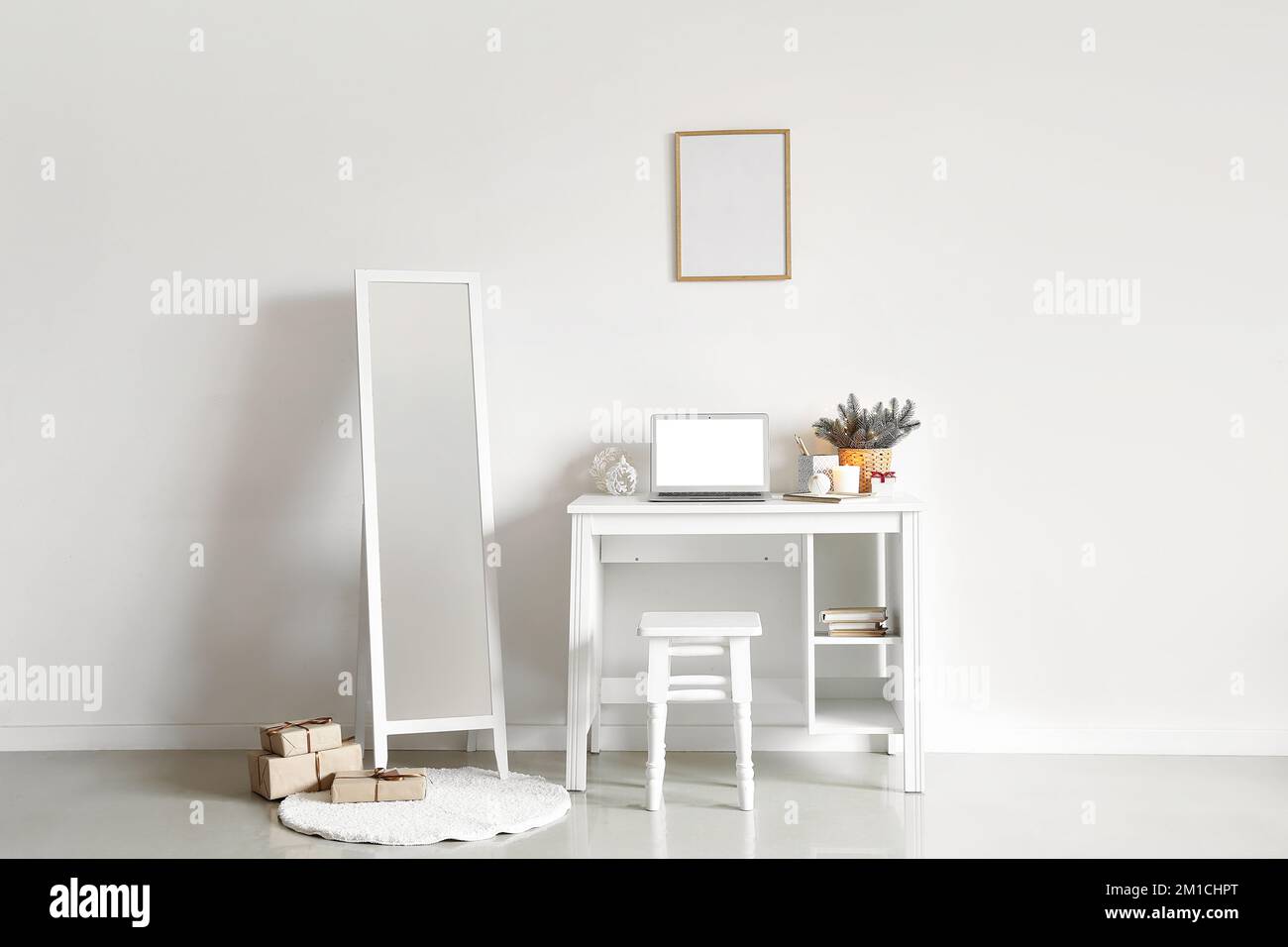 Interior of office with workplace, mirror and Christmas presents Stock ...