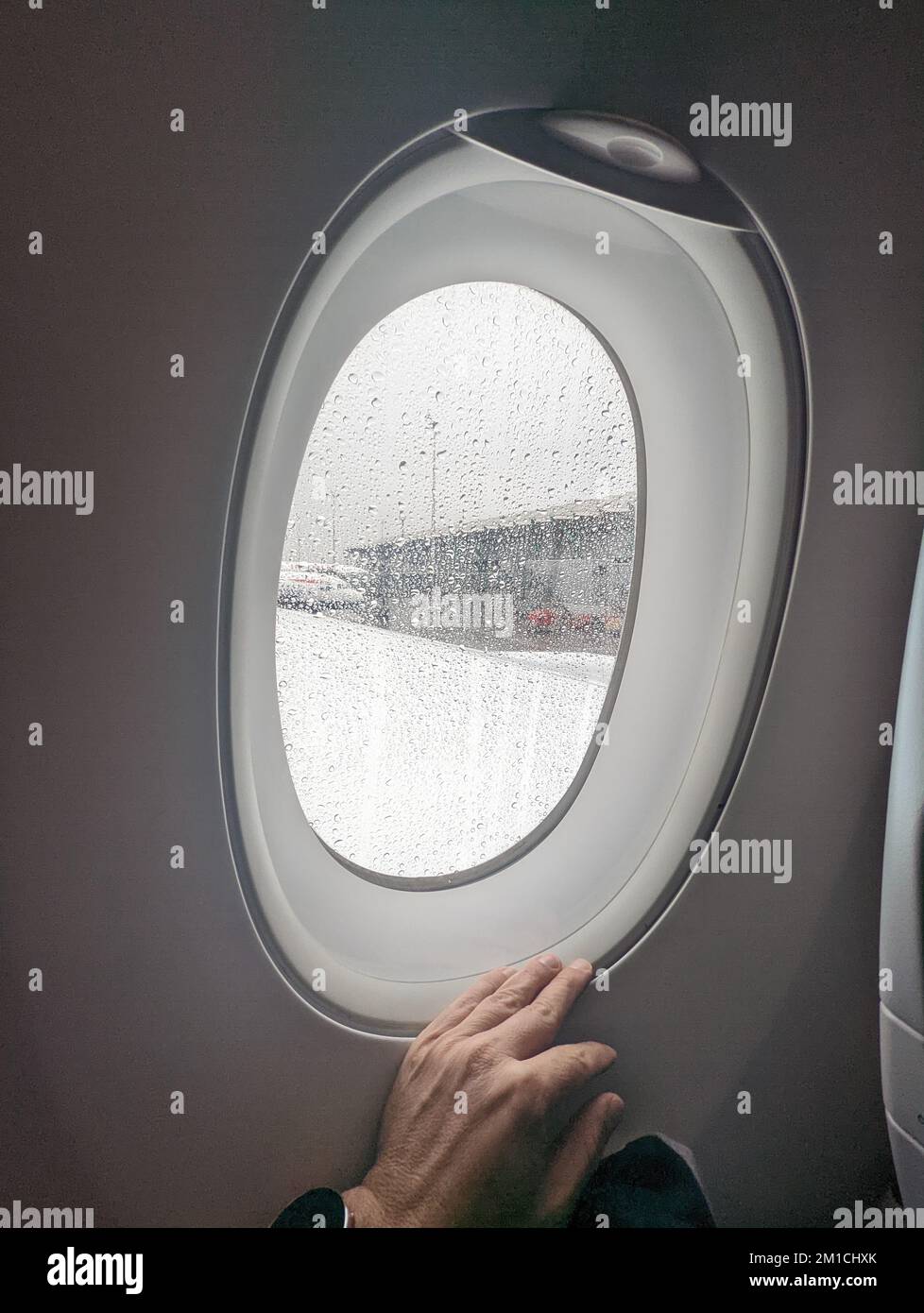airplane window seen from inside the plane Stock Photo - Alamy