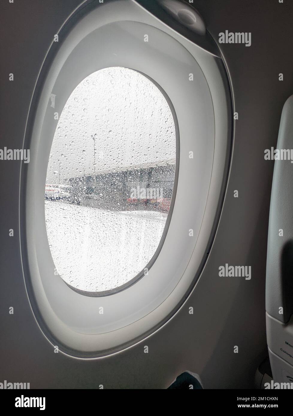 airplane window seen from inside the plane Stock Photo - Alamy