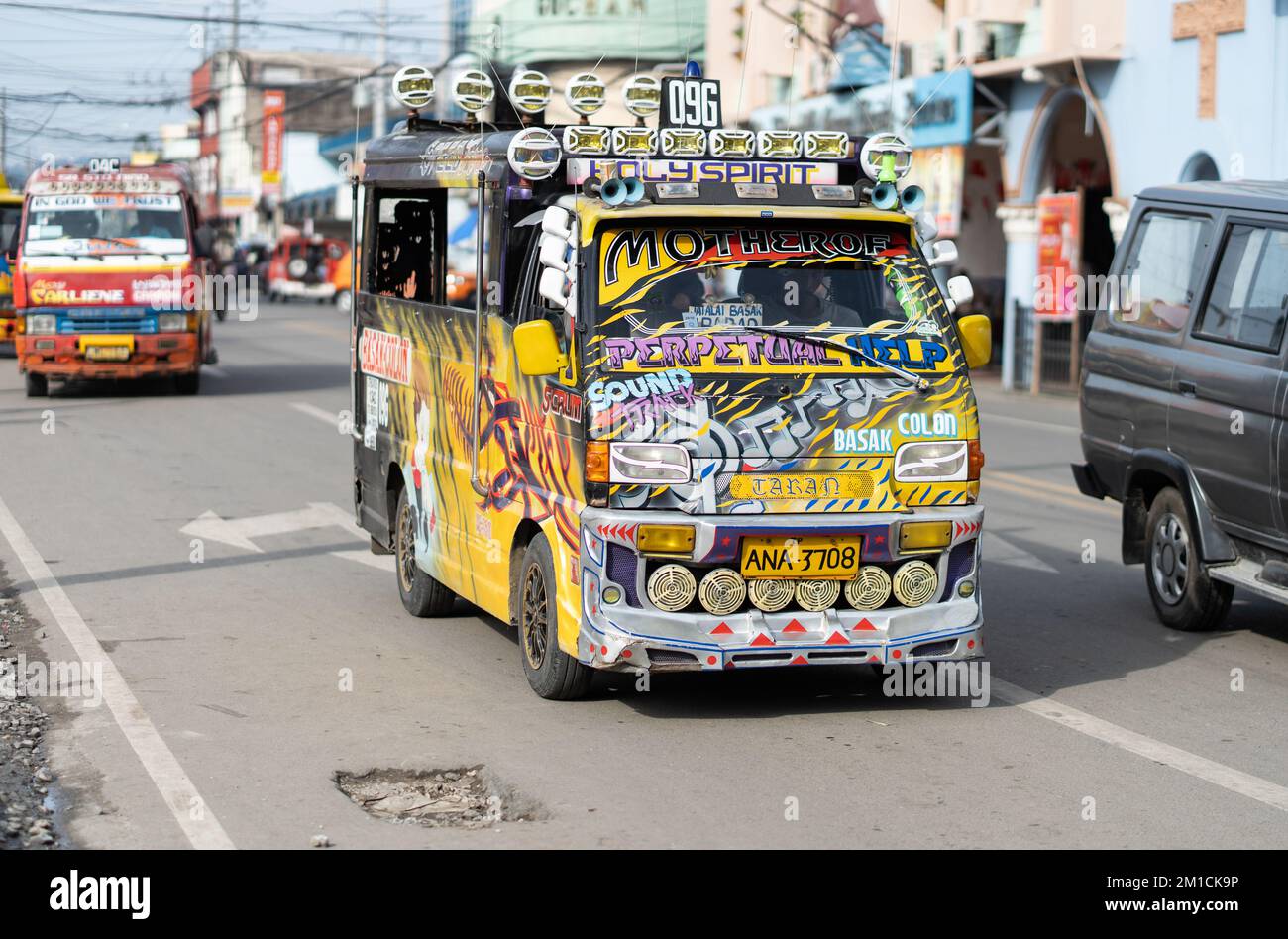 A colourful Jeepney Multicab travels along a street in Cebu City, Philippines Stock Photo - Alamy