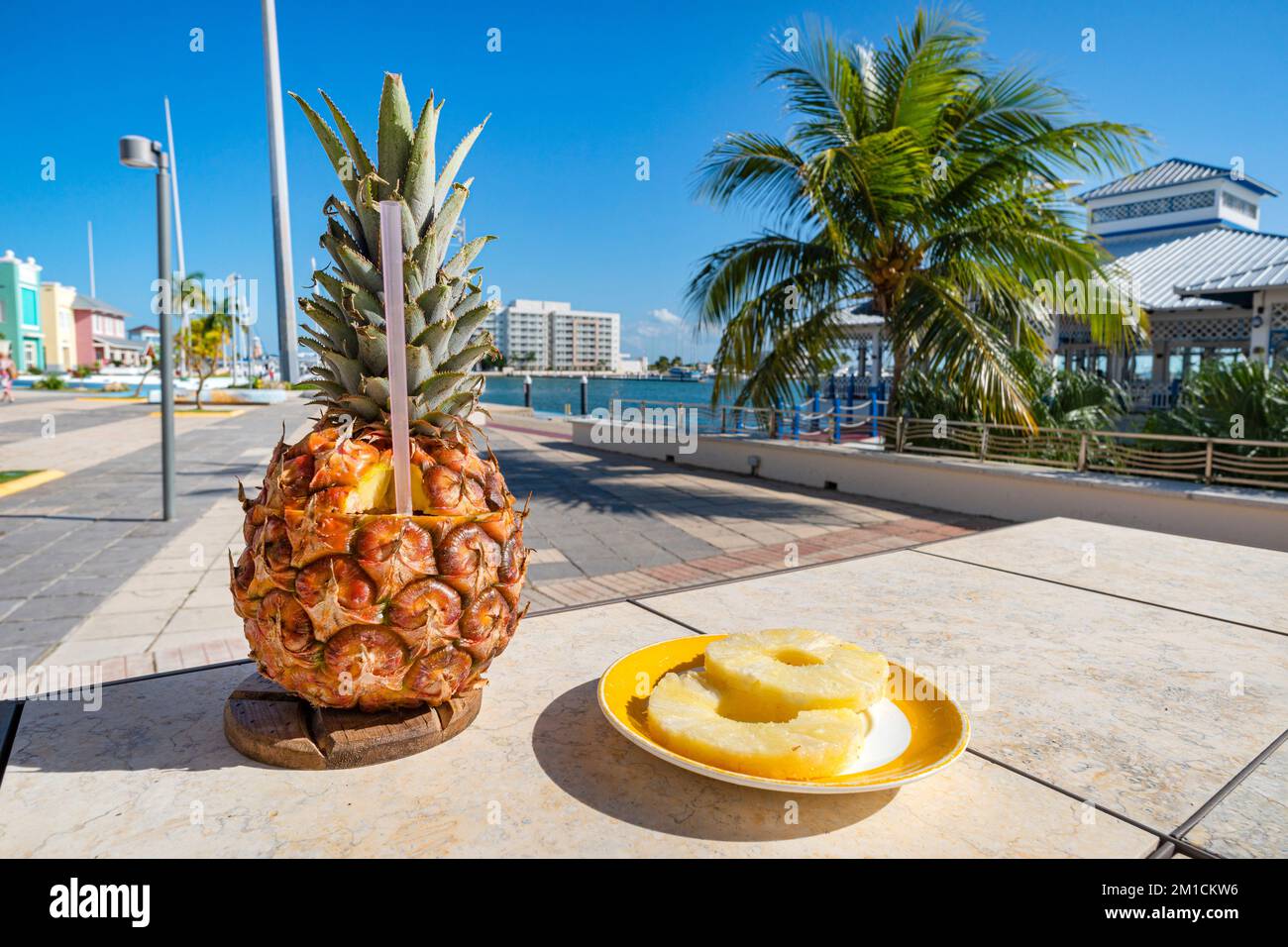 Fresh Pina Colada Cocktail Served in Pineapple on the table against the ...