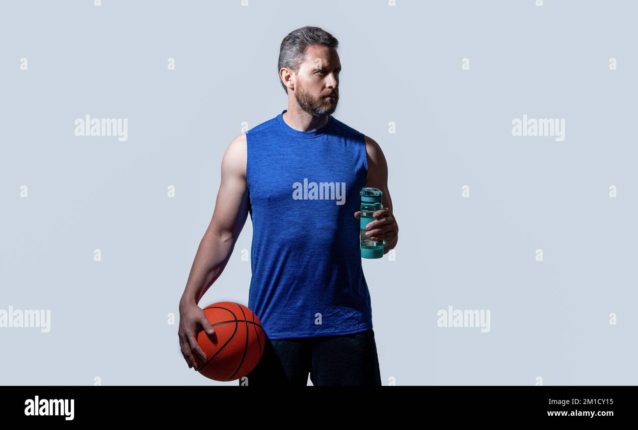 sport man basketball player drink water in studio. photo of sport man ...