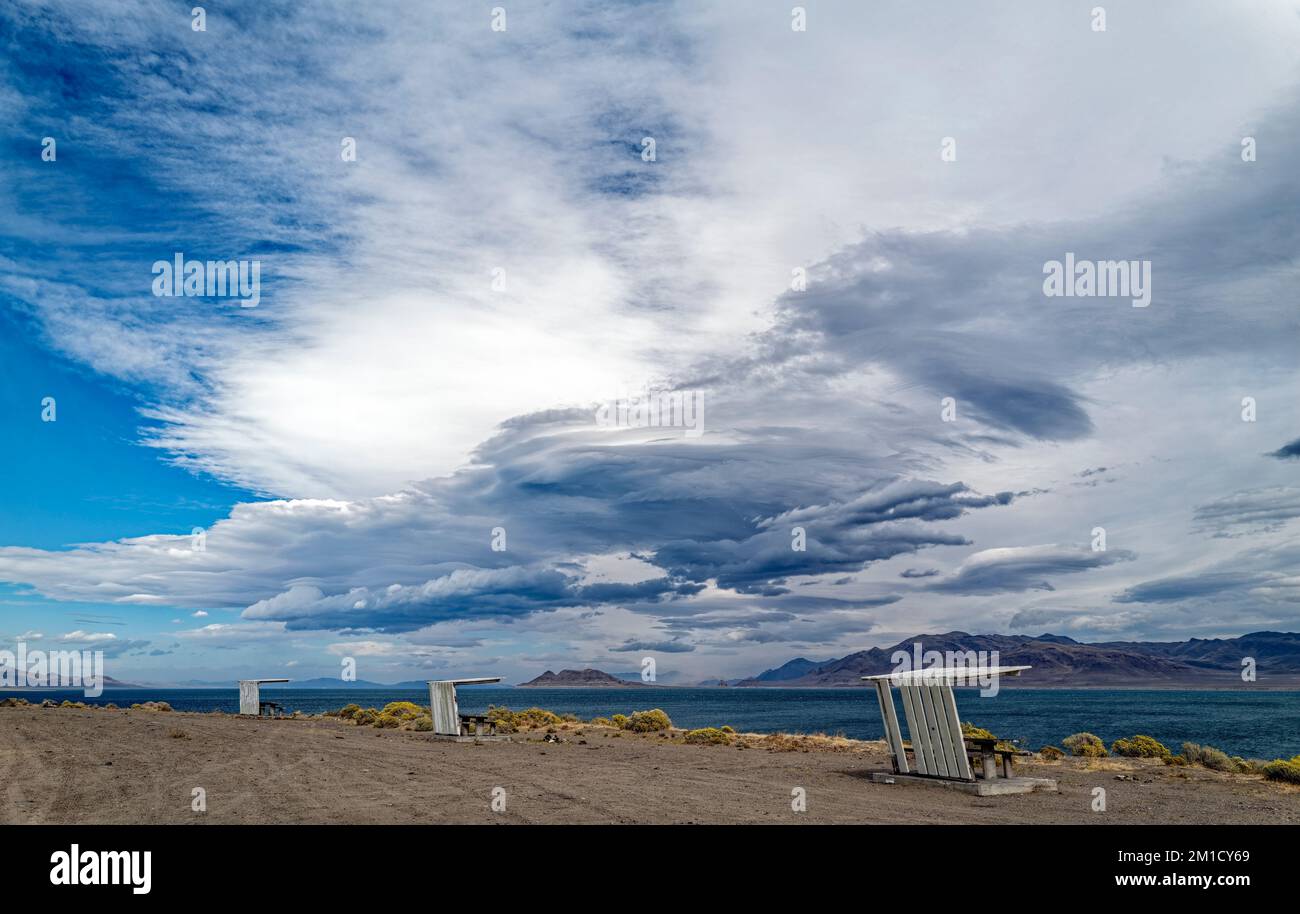 Sheltered picnic tables line the shore of Pyramid Lake at Karaban Beach ...