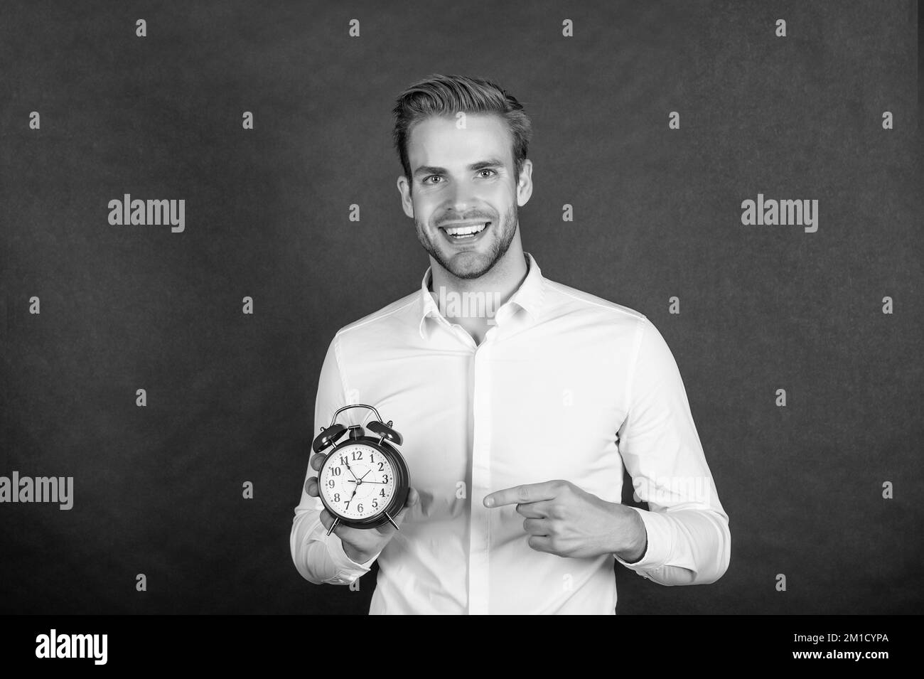 Happy businessman alarm clock Black and White Stock Photos & Images - Alamy
