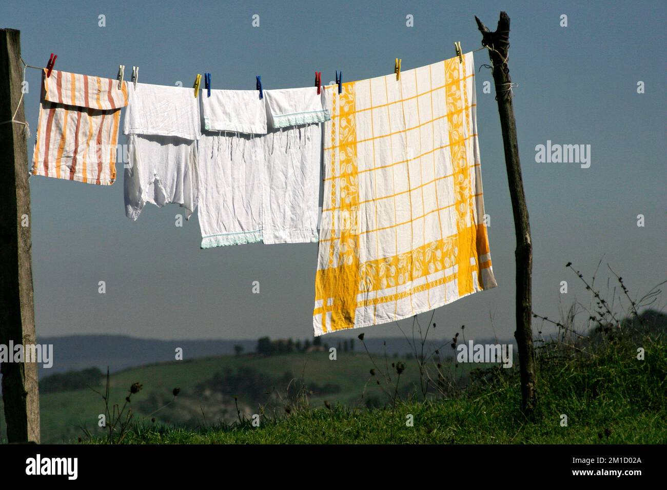 Washing on clothes line in front of tuscanian landscape, Italy Stock ...