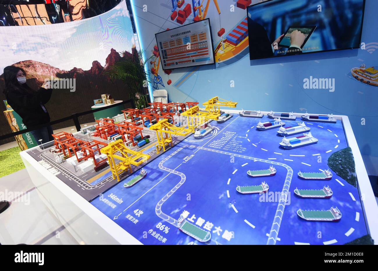 HANGZHOU, CHINA - DECEMBER 12, 2022 - Visitors look at a Smart Seaport ...