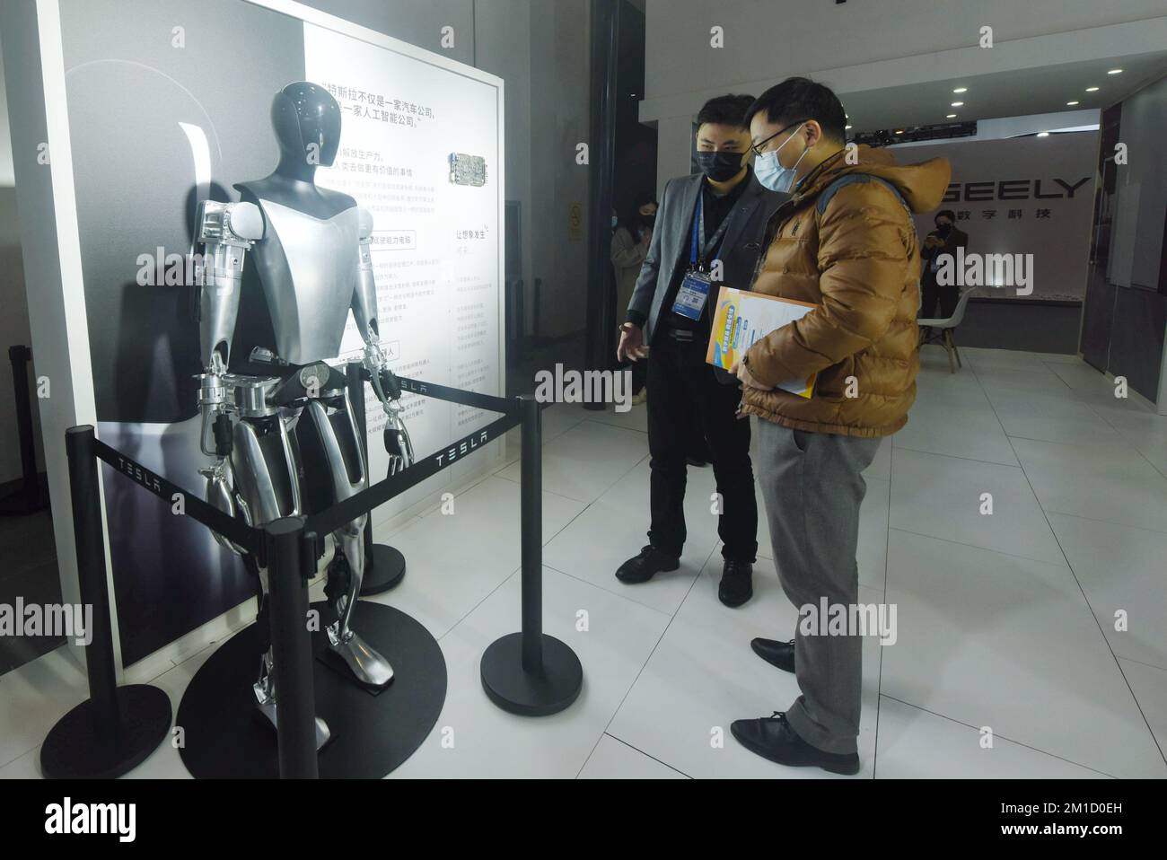 HANGZHOU, CHINA - DECEMBER 12, 2022 - Visitors look at Tesla's humanoid ...