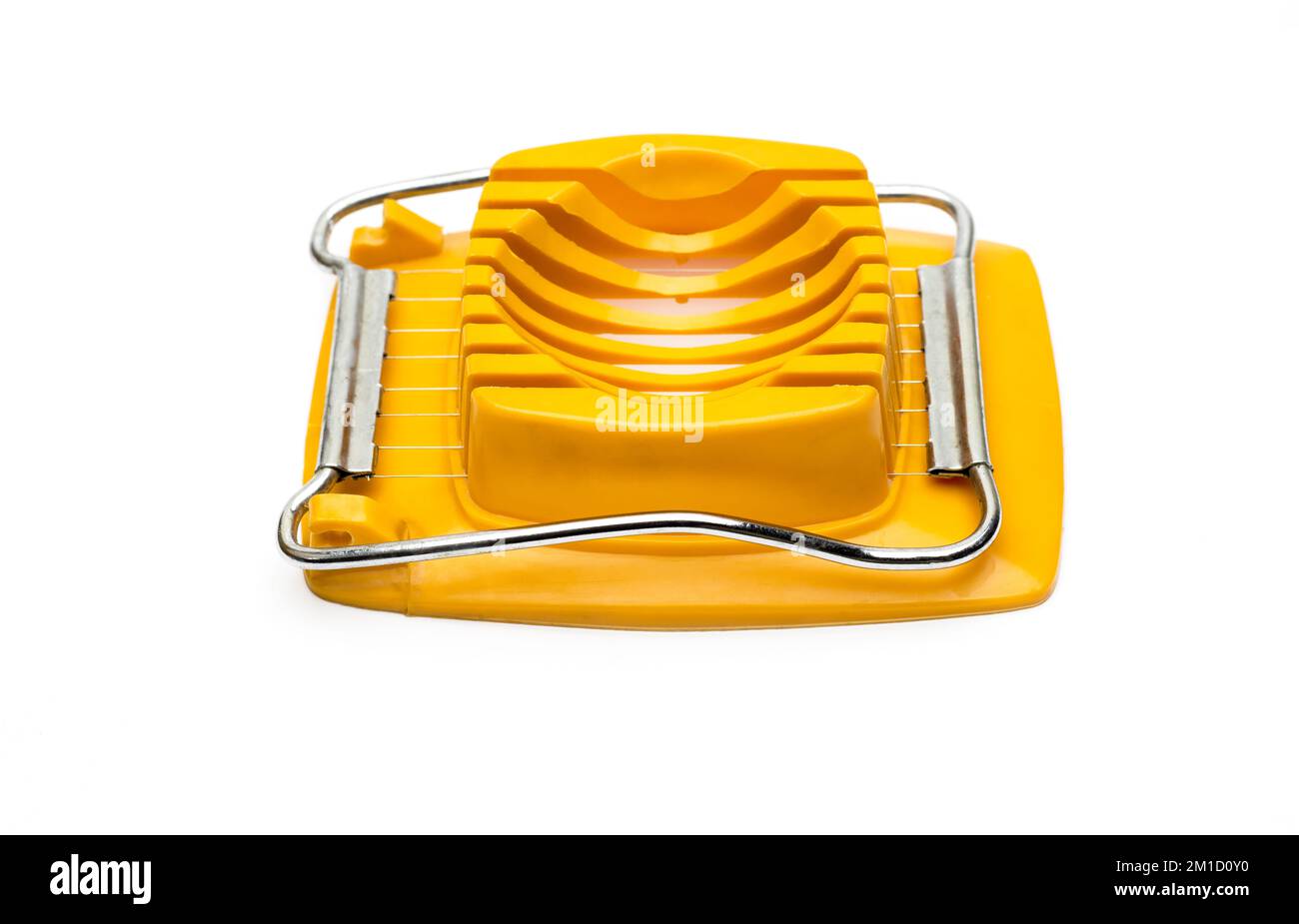 Old egg cutter close up on isolated white background Stock Photo - Alamy