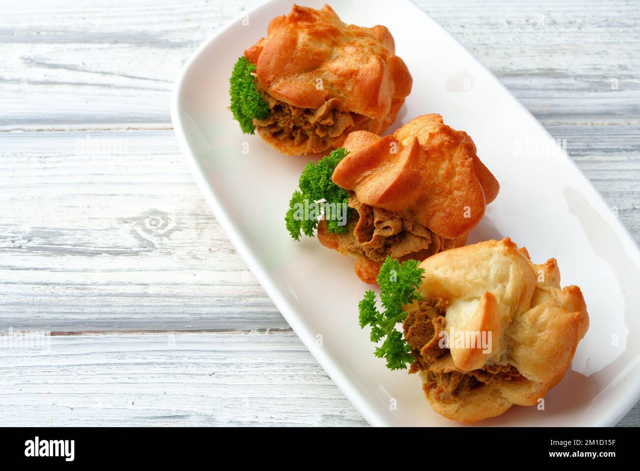 Profiteroles stuffed with soft mousse banquet food snacks Stock Photo ...