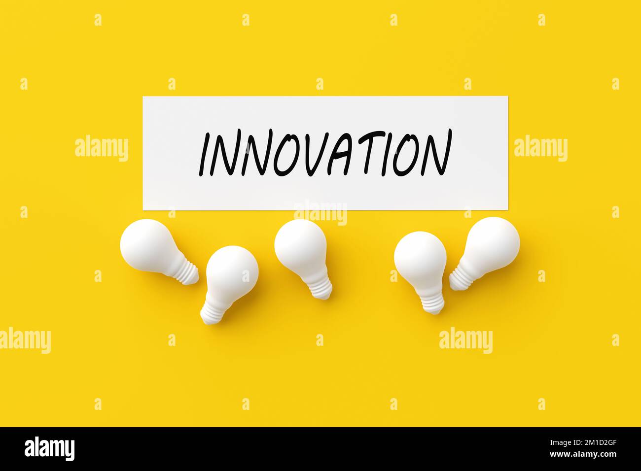 The word innovation on white paper with light bulbs. Innovation and ...