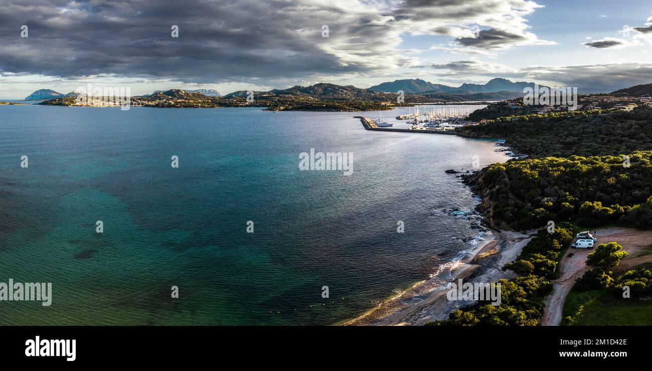 A panorama view of the coast and harbor of Portisco in Sardinia Stock ...