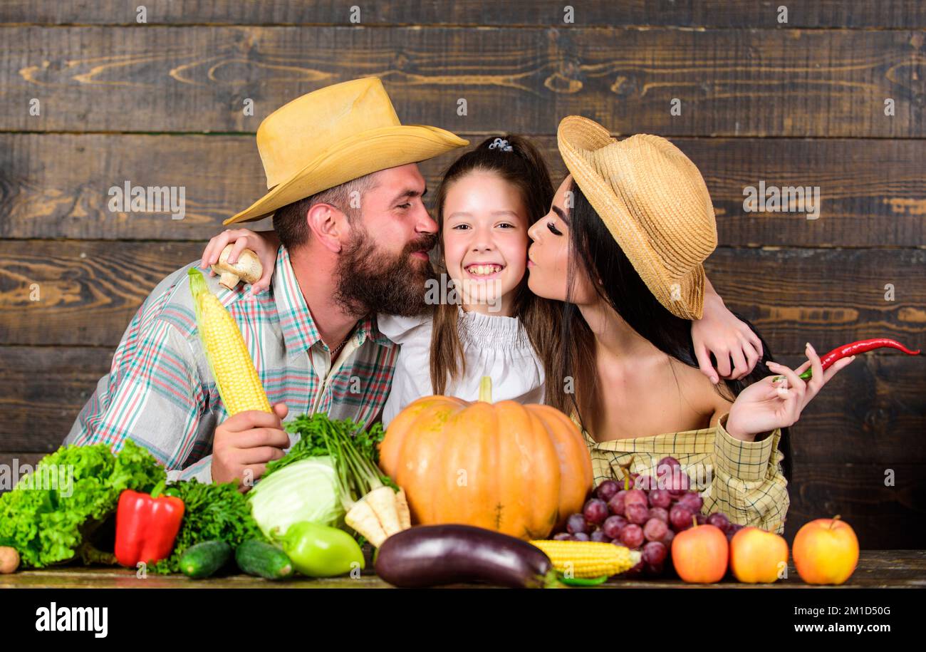 Family rustic style farmers at market with vegetables fruits and ...
