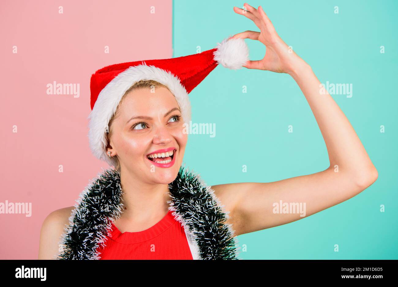Girl cheerful face celebrate christmas. Woman with tinsel celebrate ...