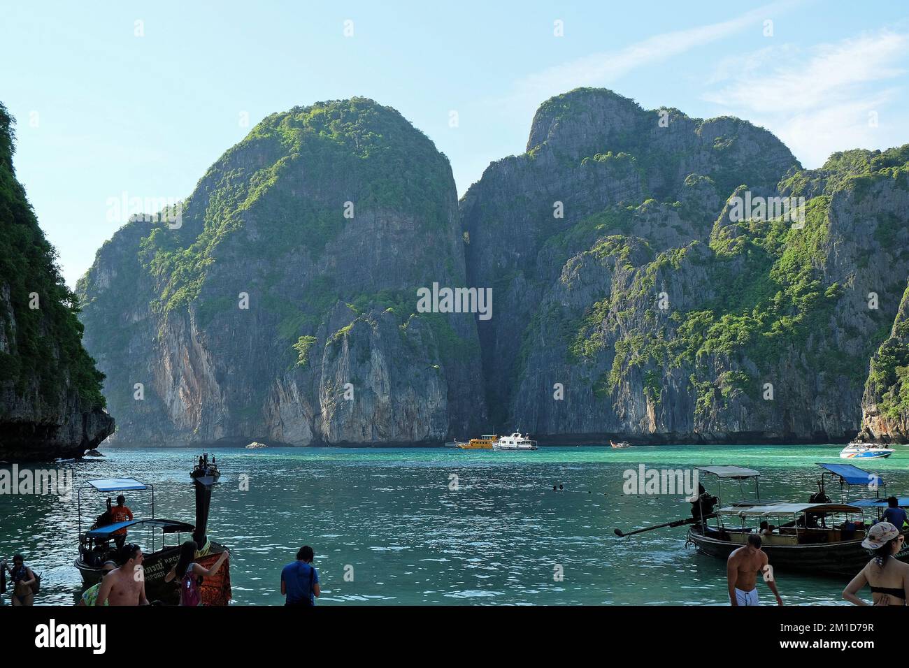 Long tail boat with natural landscape of green mountain cliff and ...