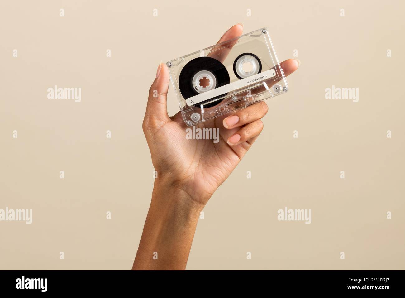 Crop anonymous African American female demonstrating vintage retro ...
