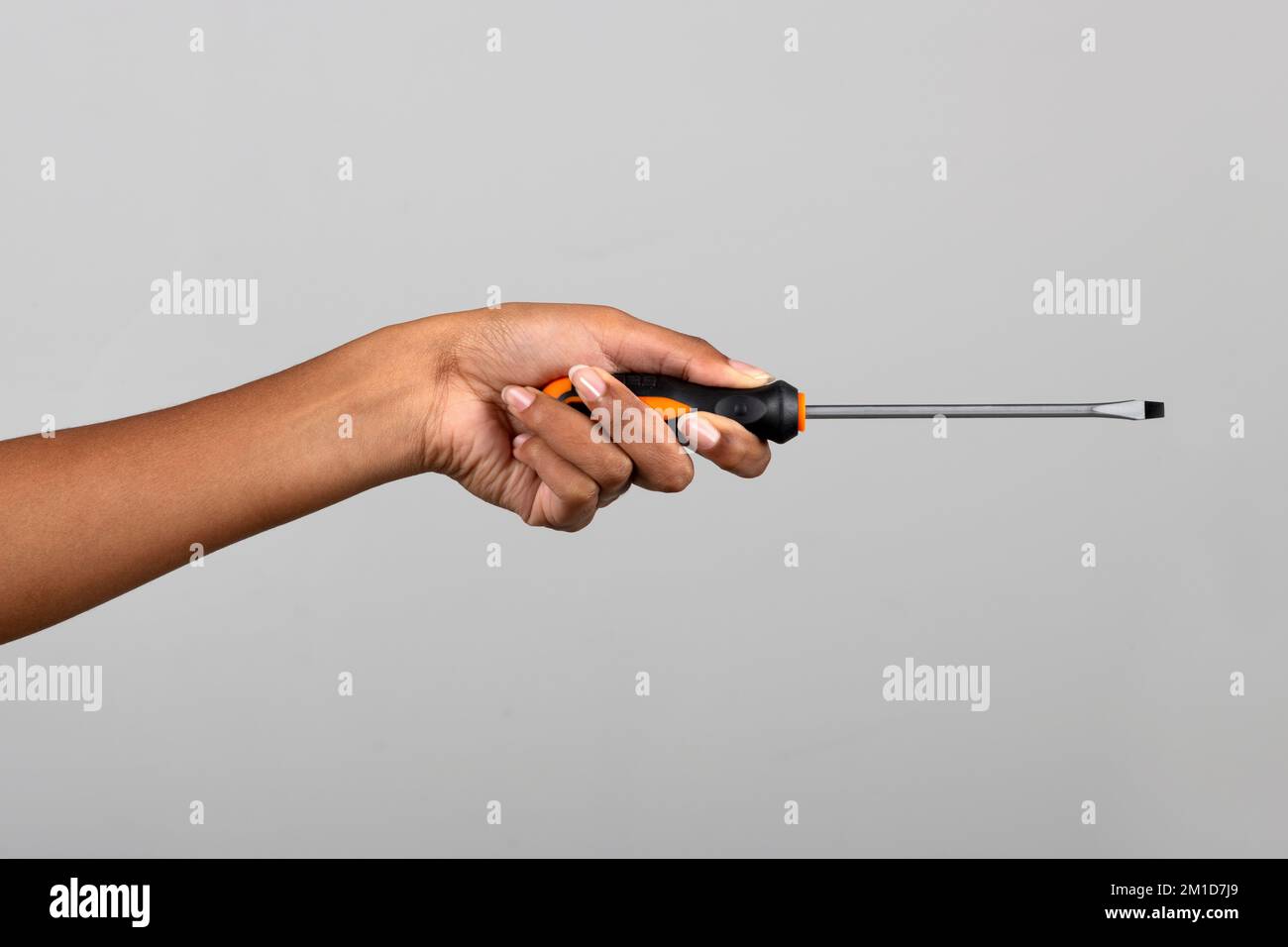 Crop anonymous African American female demonstrating modern black and ...