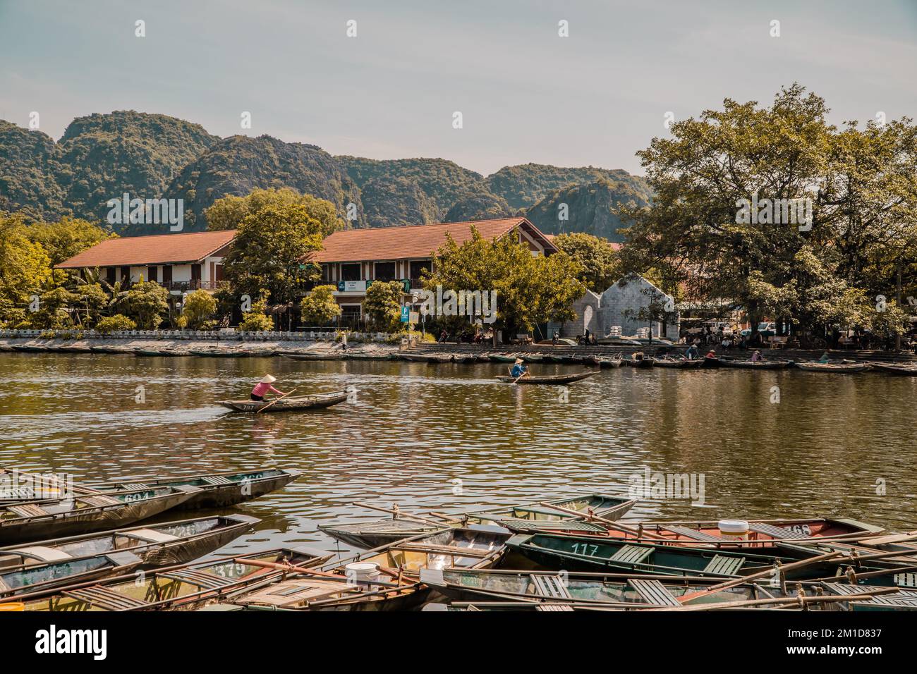 Boats in the river of Tam Coc near Ninh Binh, Vietnam Stock Photo - Alamy