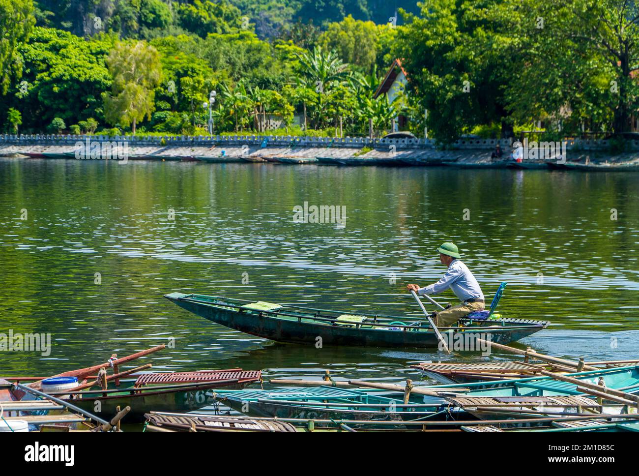 Boats in the river of Tam Coc near Ninh Binh, Vietnam Stock Photo - Alamy