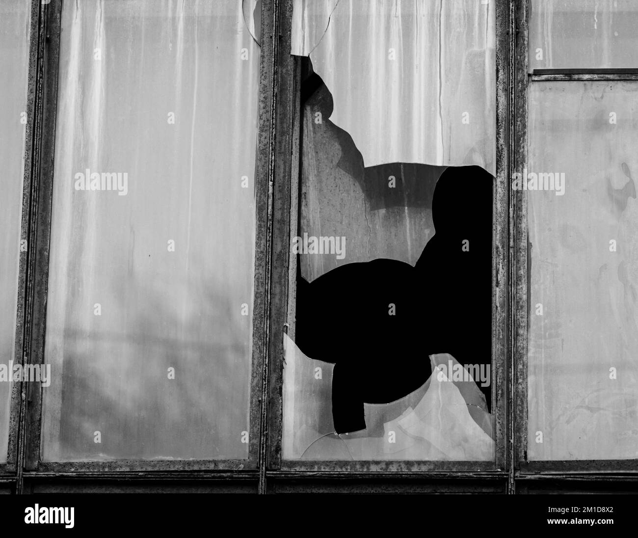 smashed window. Broken glass in a wooden window frame Stock Photo - Alamy