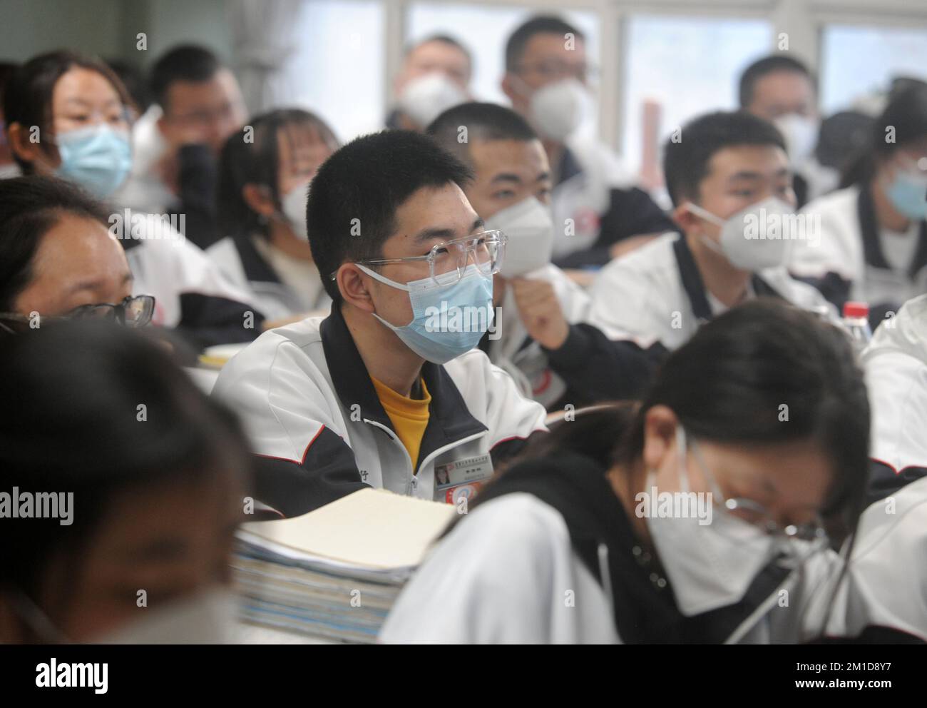 URUMQI, CHINA - DECEMBER 12, 2022 - Senior three students wear masks ...