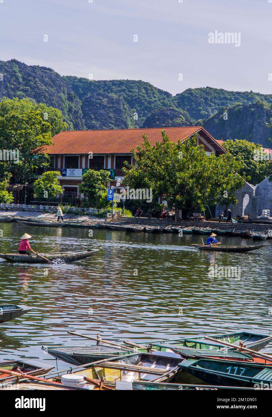 Boats in the river of Tam Coc near Ninh Binh, Vietnam Stock Photo - Alamy