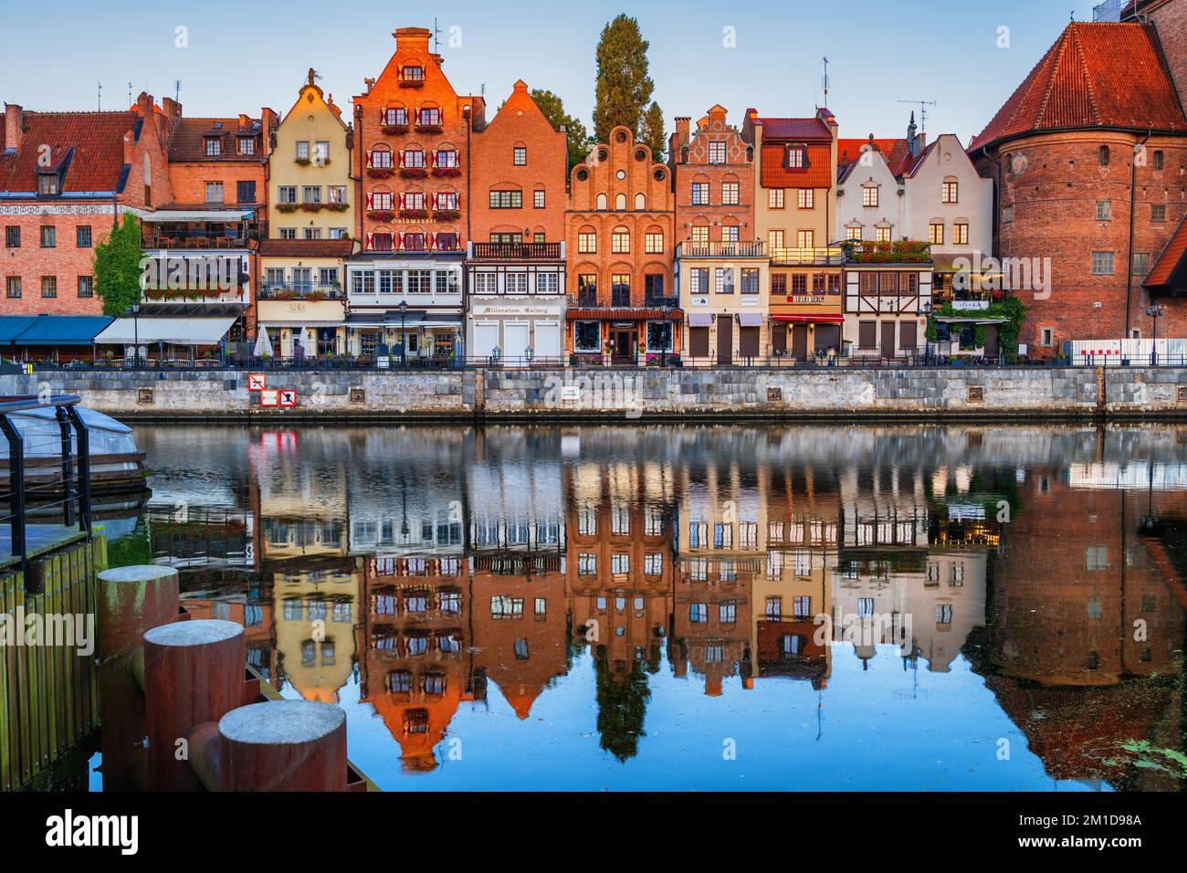 Old Town in city of Gdansk at sunrise in Poland. Picturesque river view ...