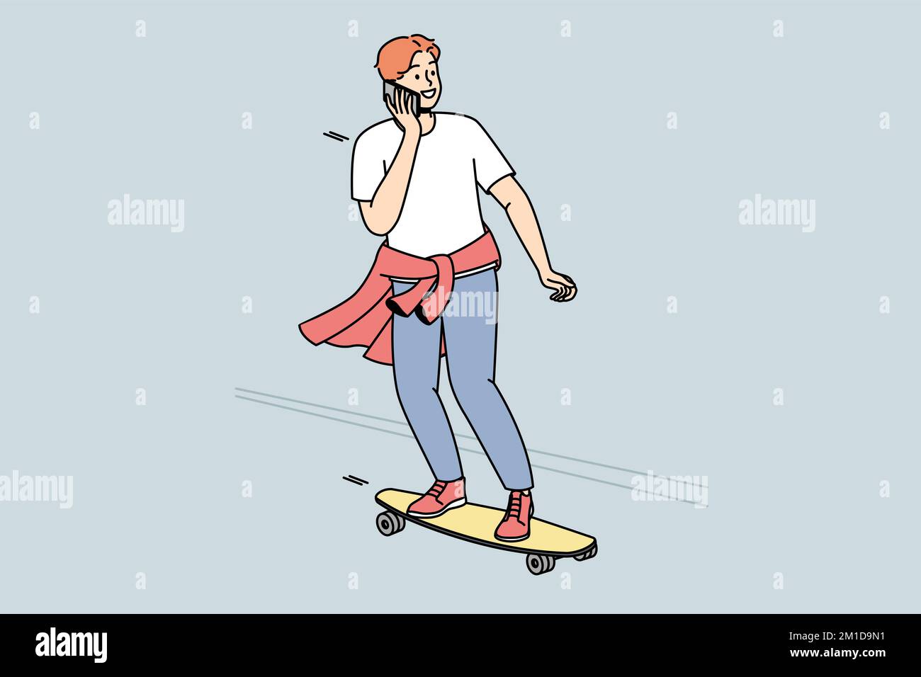 Guy is rolling on skateboard down street and talking on cellphone at ...