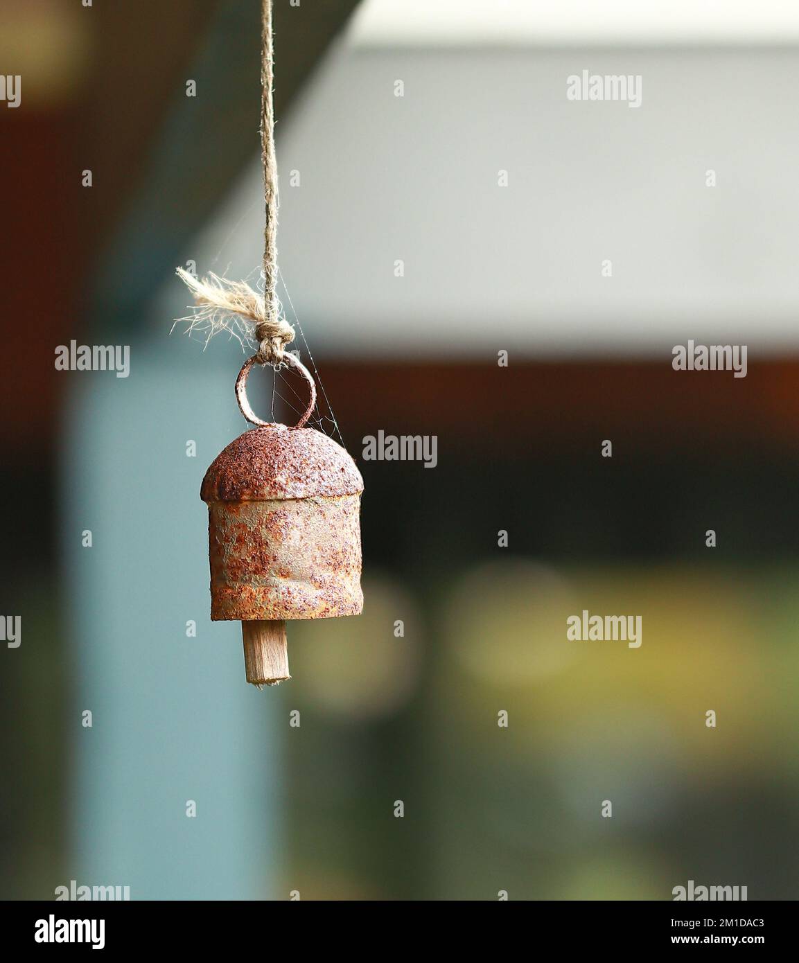 wooden clapper bell hanging on backyards Stock Photo - Alamy