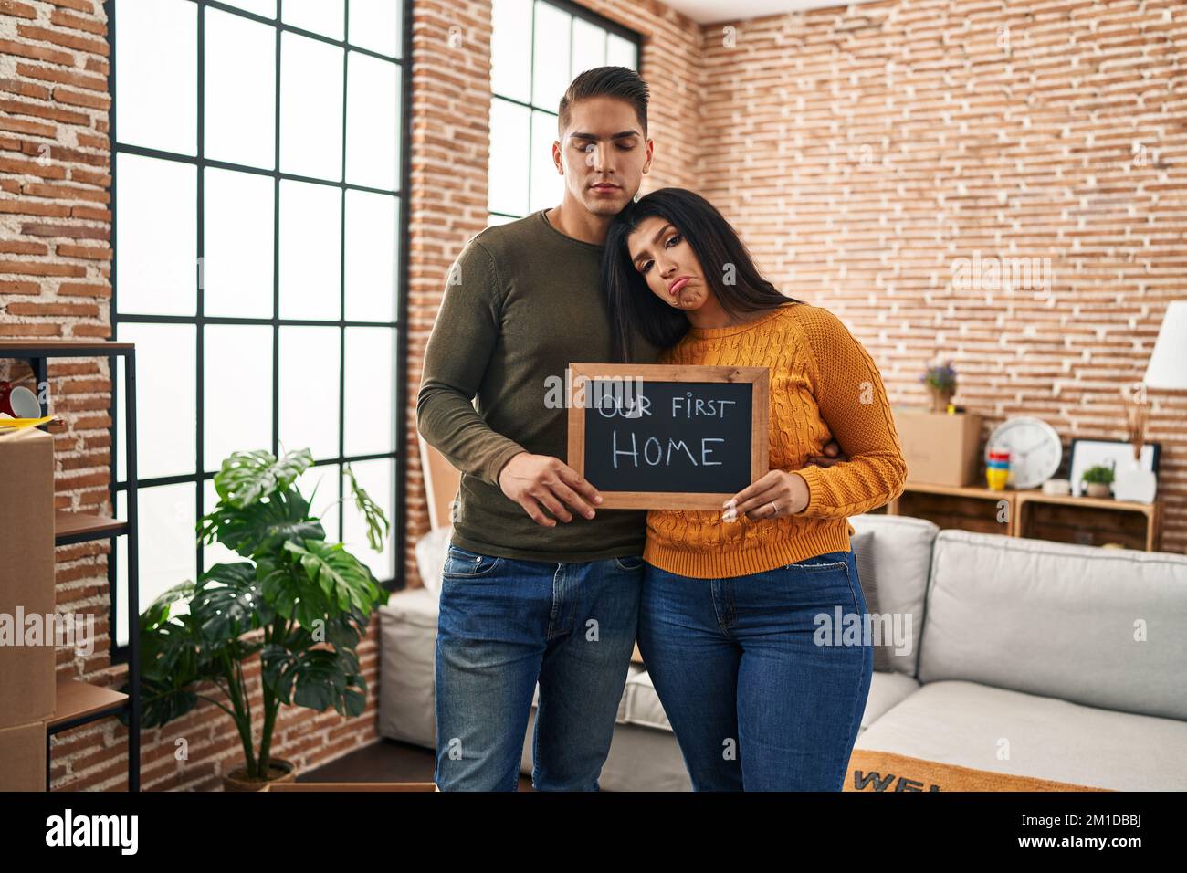 Young couple moving to a new home depressed and worry for distress ...