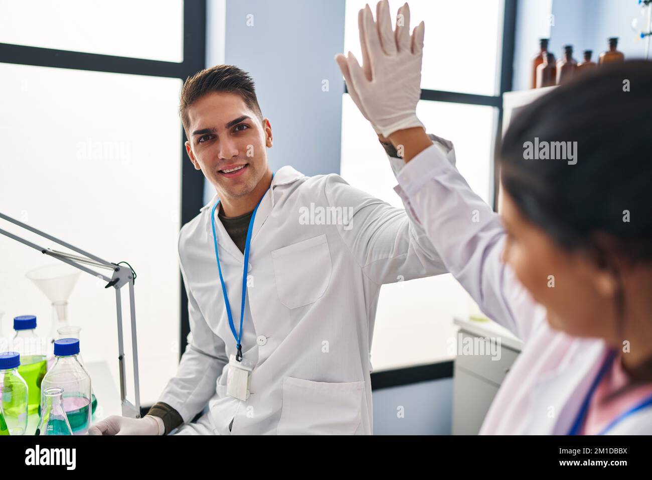 High five achievement scientists hi-res stock photography and images ...
