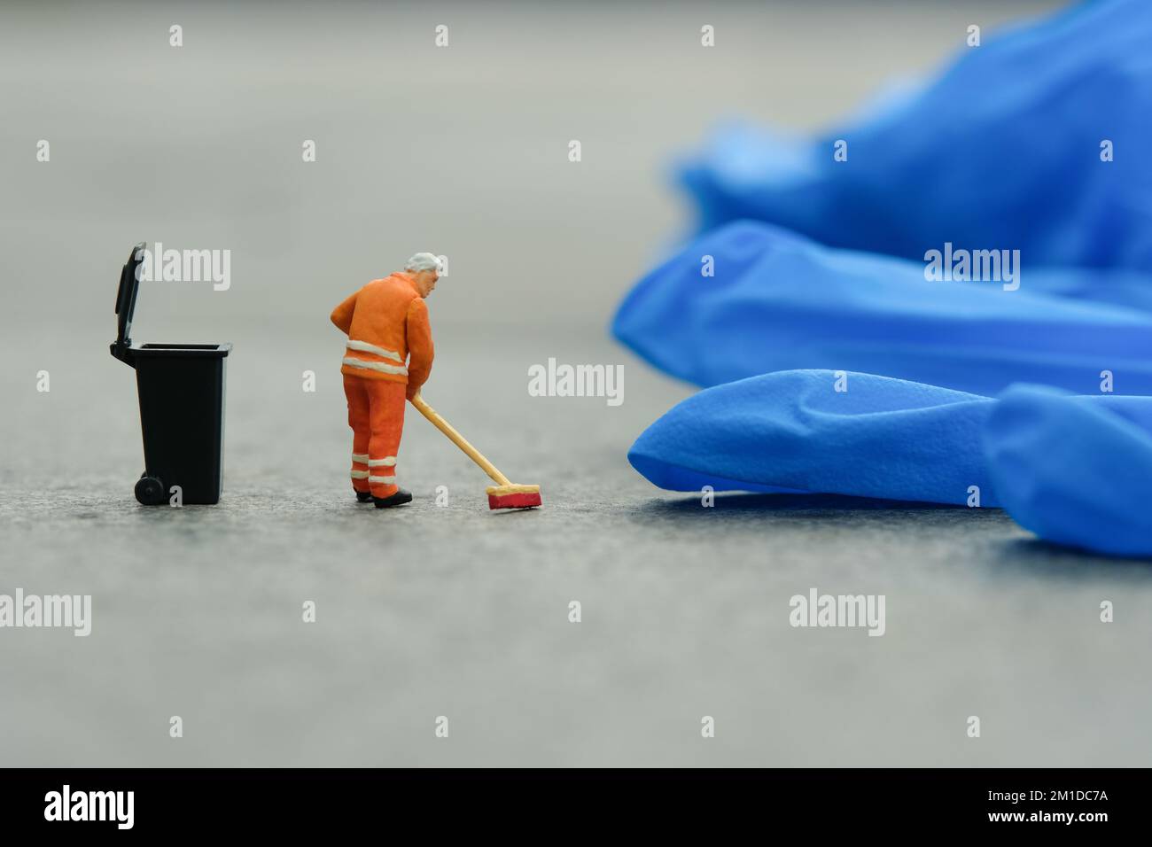 Miniature people toy figure photography. Old man sweeper cleaning ...