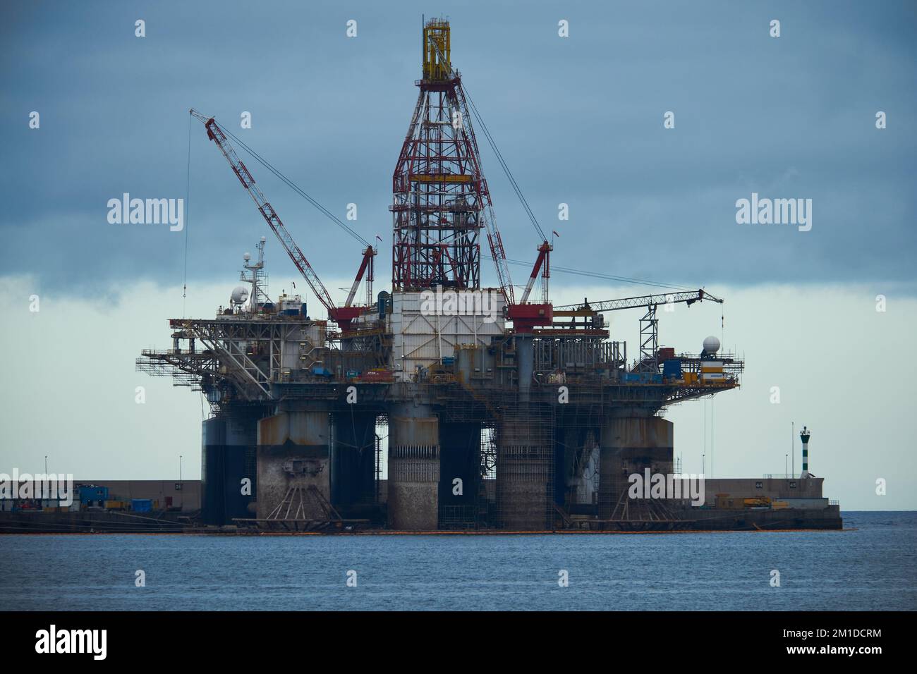 The oil platform in the port of Las Palmas with a stormy sky in the ...