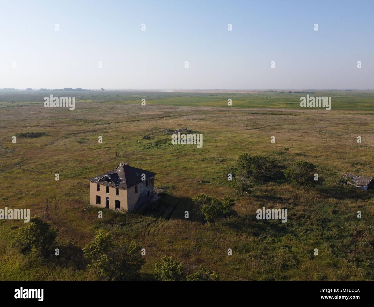 An aerial shot of the abandoned farmhouse in Prairies in Saskatchewan ...