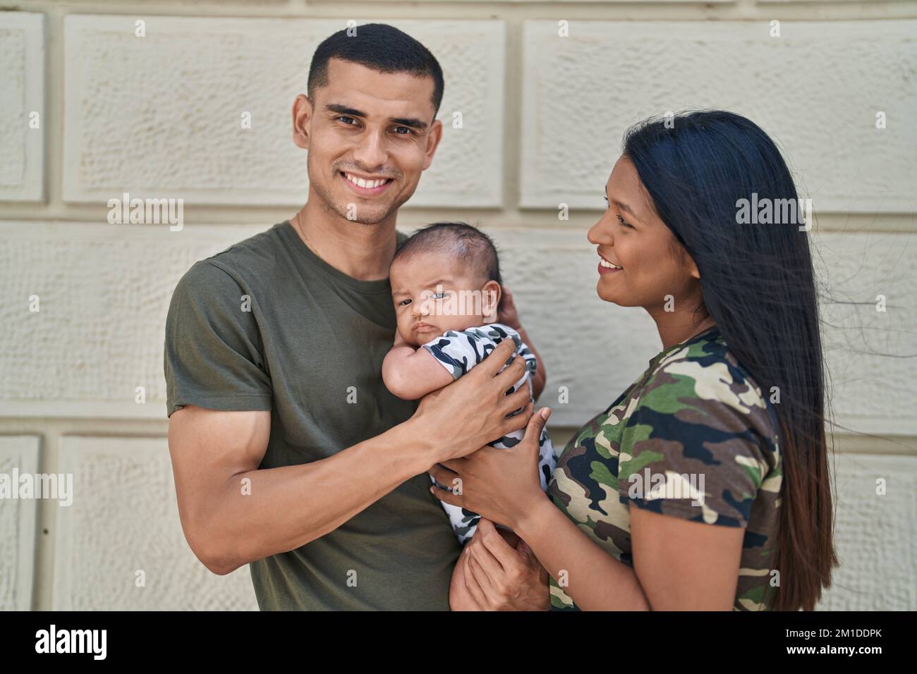 Hispanic family smiling confident hugging each other over isolated ...