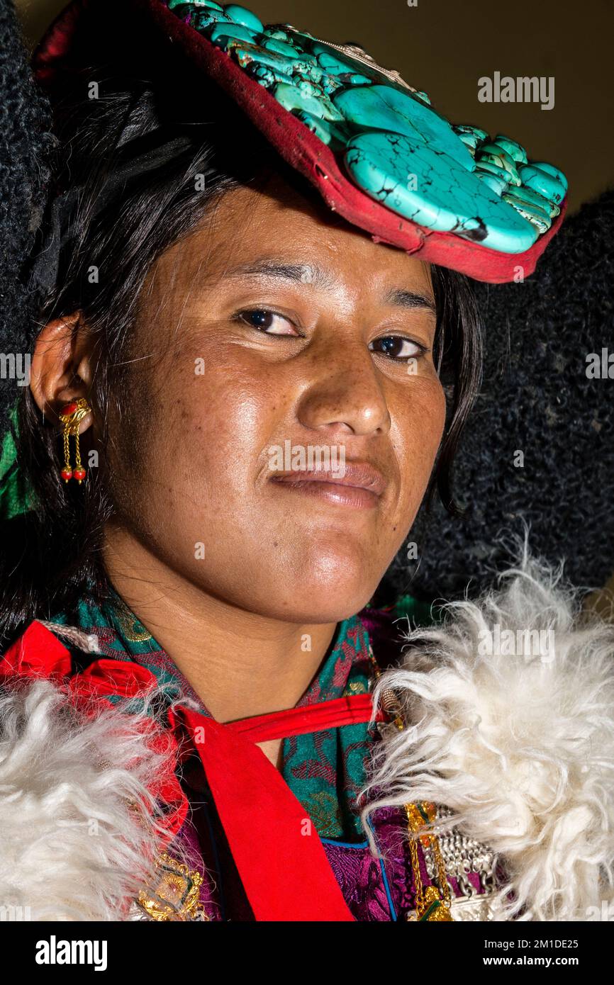 A ladakhi woman is wearing a Perak, part of the traditional dress and ...