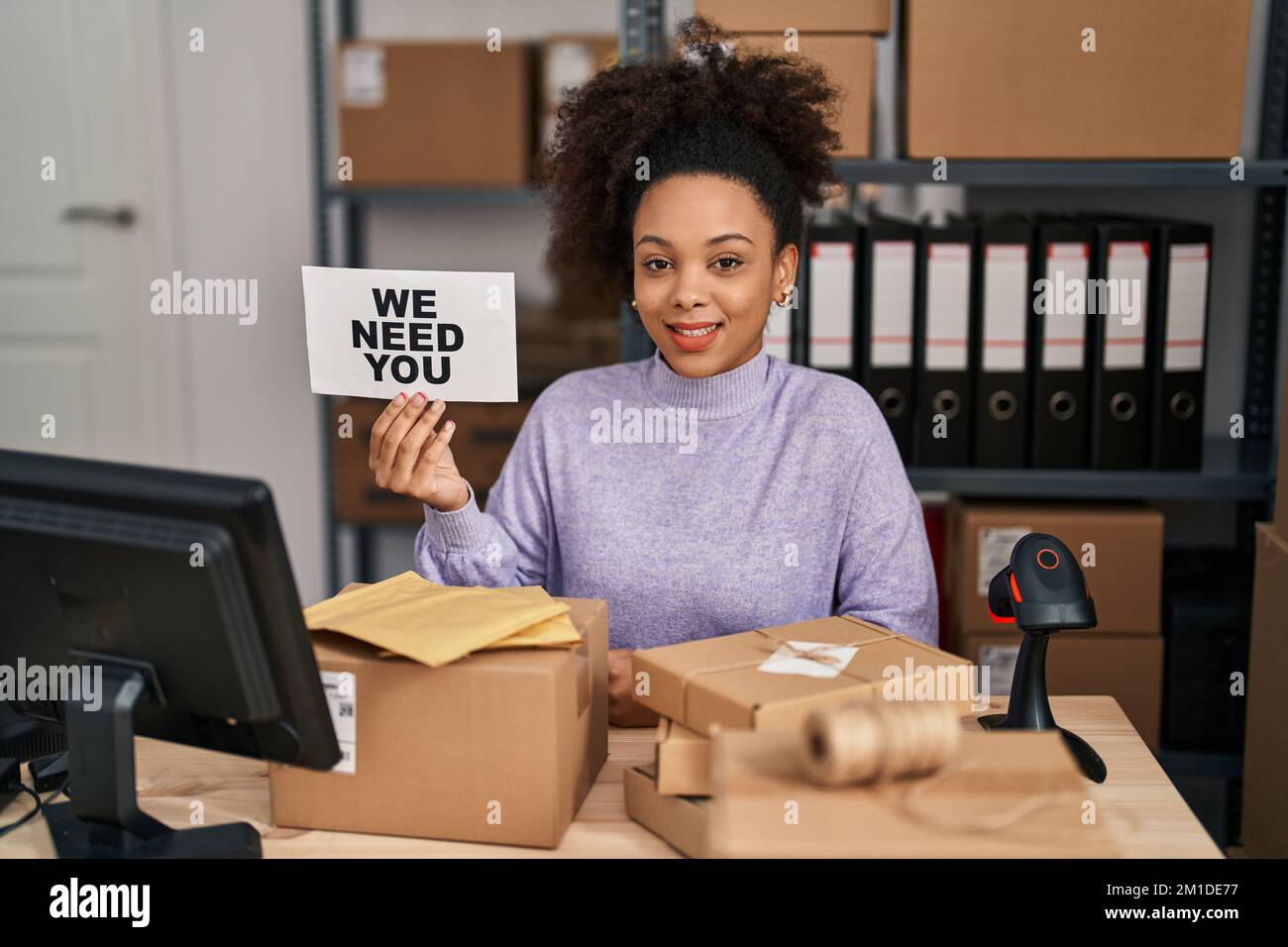 Young african american woman working at small business ecommerce ...