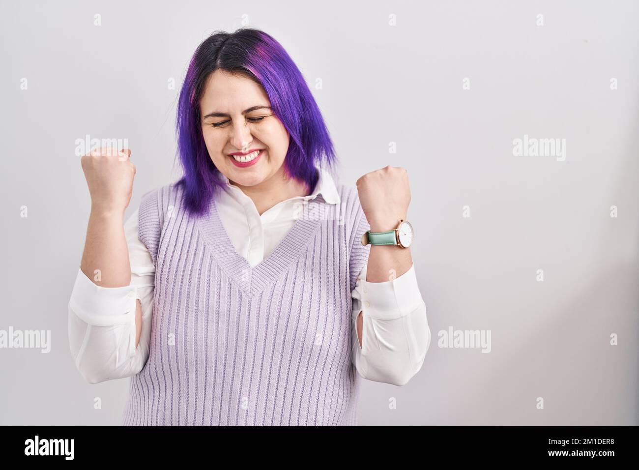 Plus size woman wit purple hair standing over white background very ...