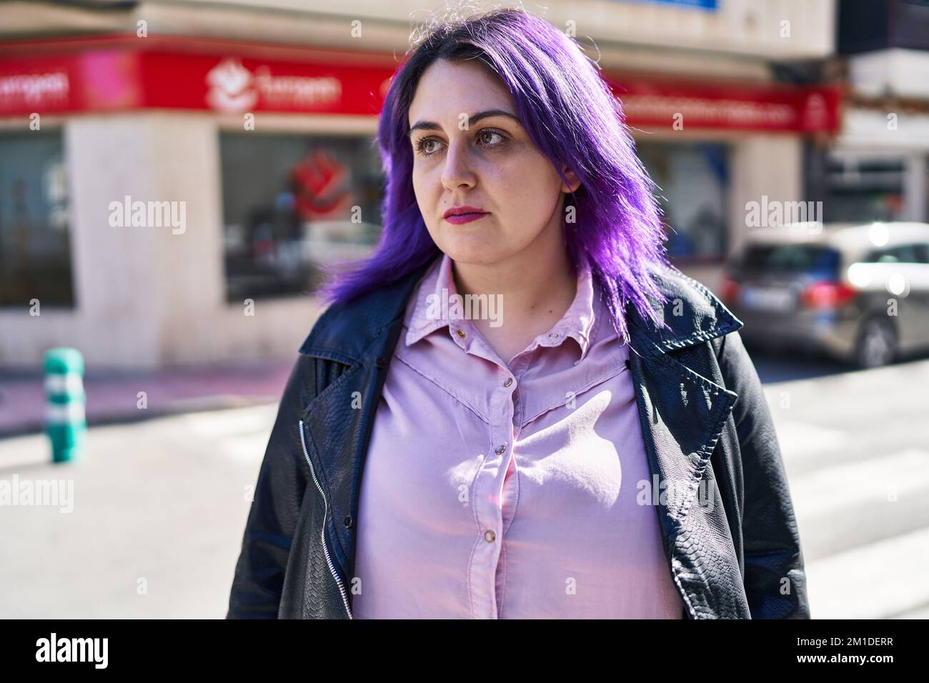 Young beautiful plus size woman looking to the side with serious ...