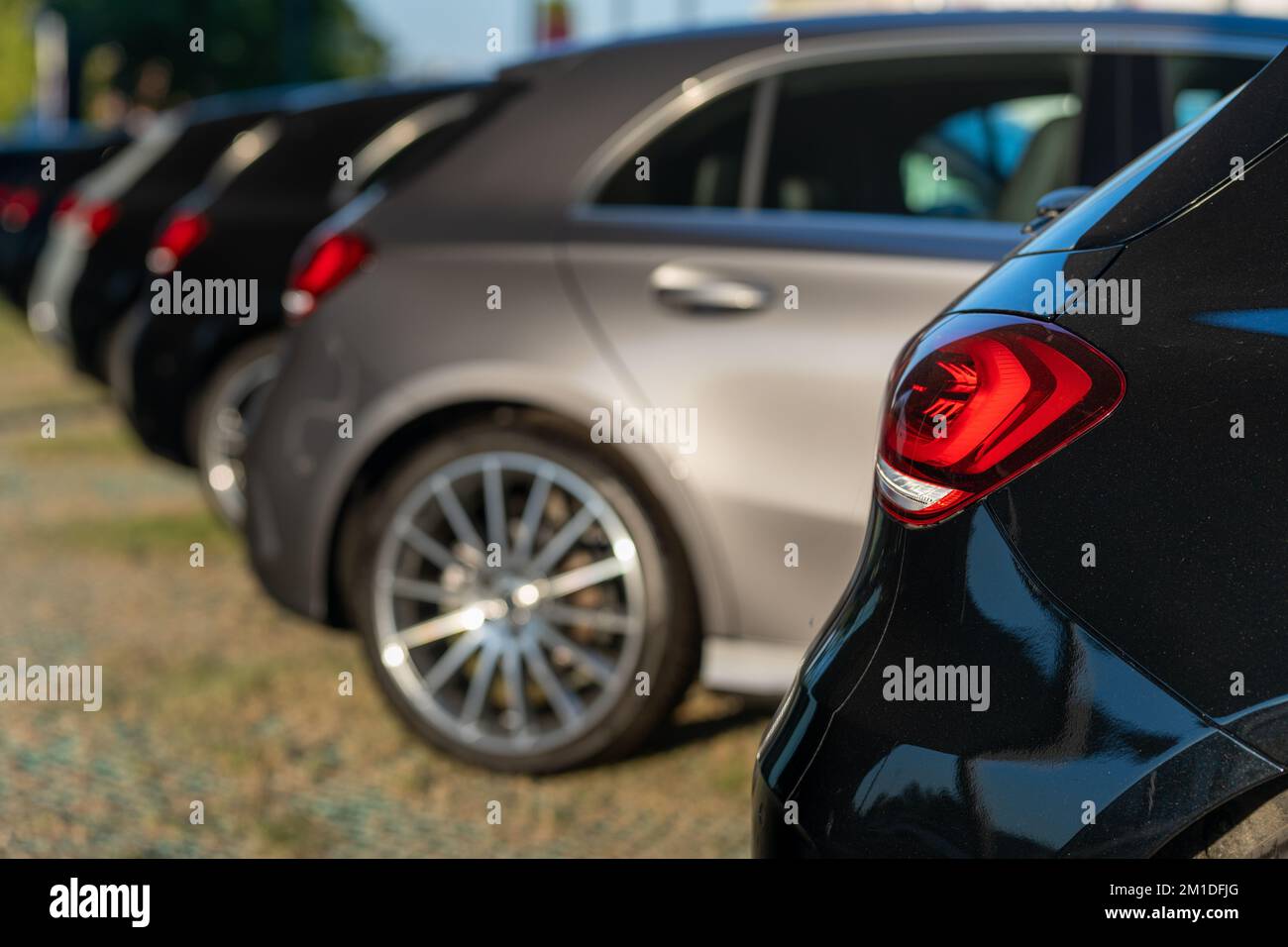 A back view of cars parked in row Stock Photo - Alamy