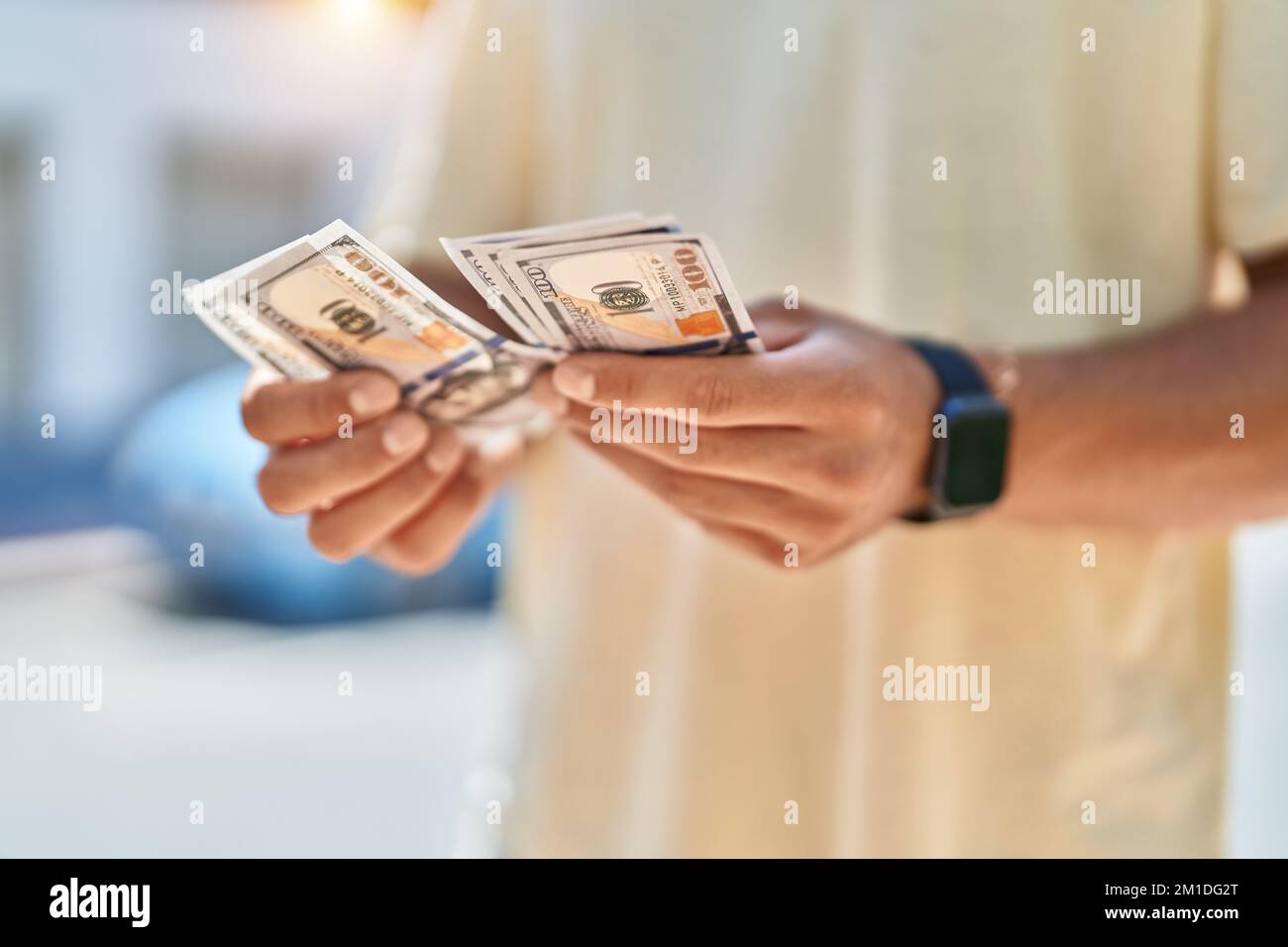 Young hispanic man counting dollars at street Stock Photo - Alamy