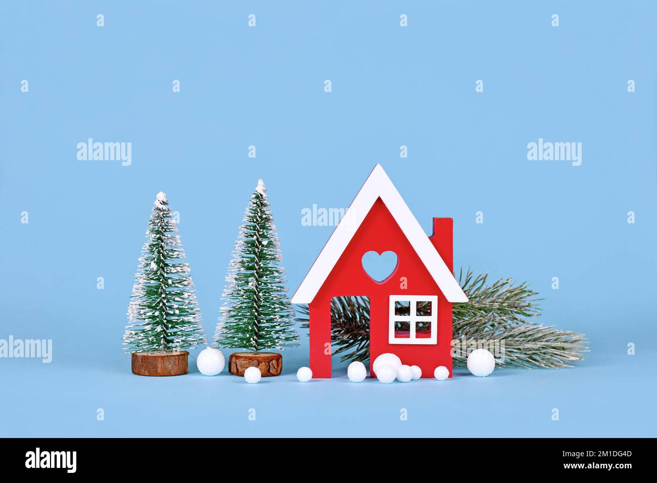 Winter decoration with small red house, Christmas trees, snowballs and ...