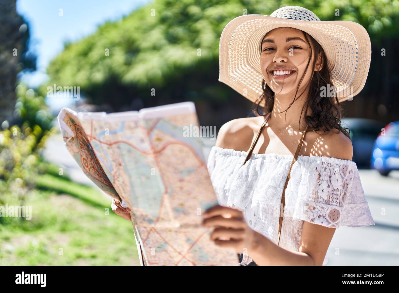 Young african american woman tourist smiling confident holding city map ...