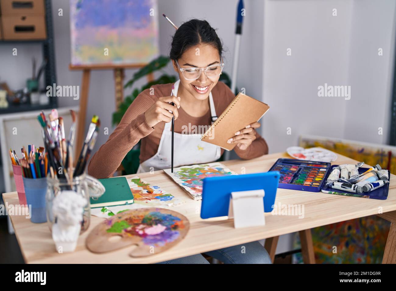 Young african american woman artist having online draw class at art ...
