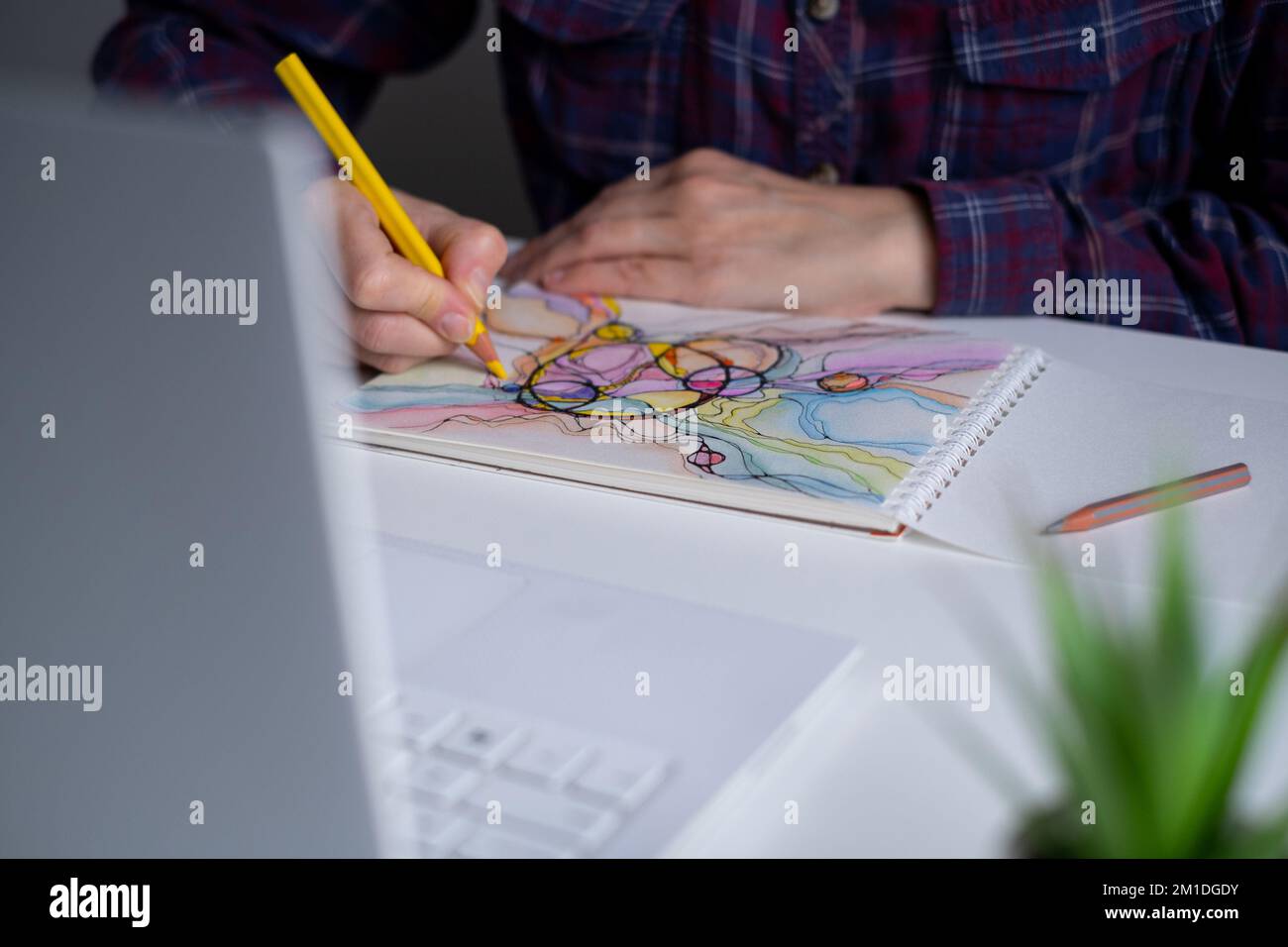 Abstract neurographic drawing with colored pencils. Close-up of hands ...
