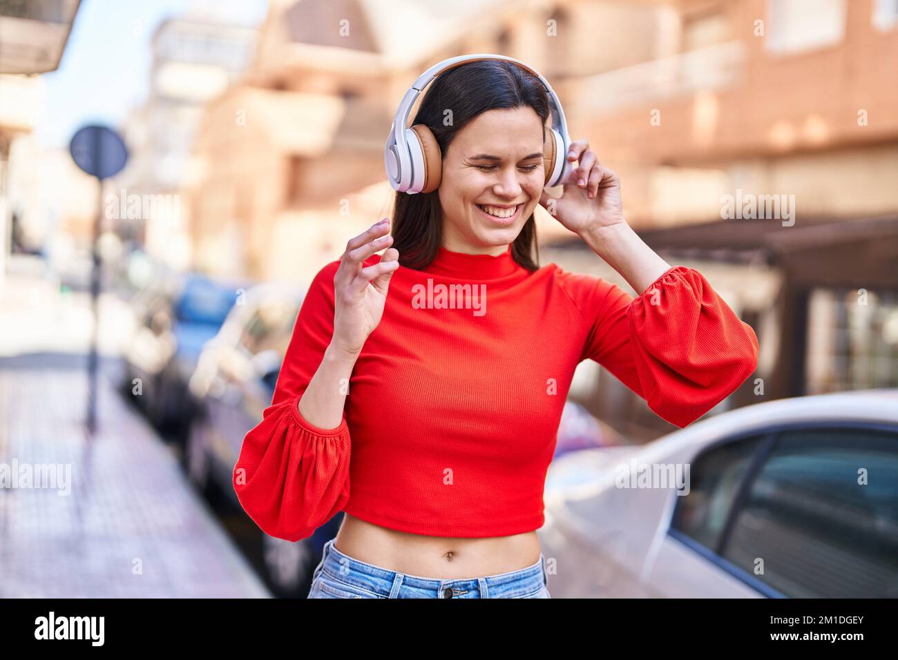 Young beautiful hispanic woman smiling confident listening to music at ...
