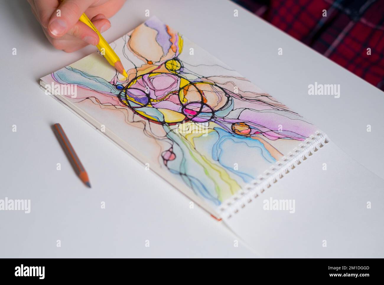 Abstract neurographic drawing with pen and colored pencils. Close-up of ...