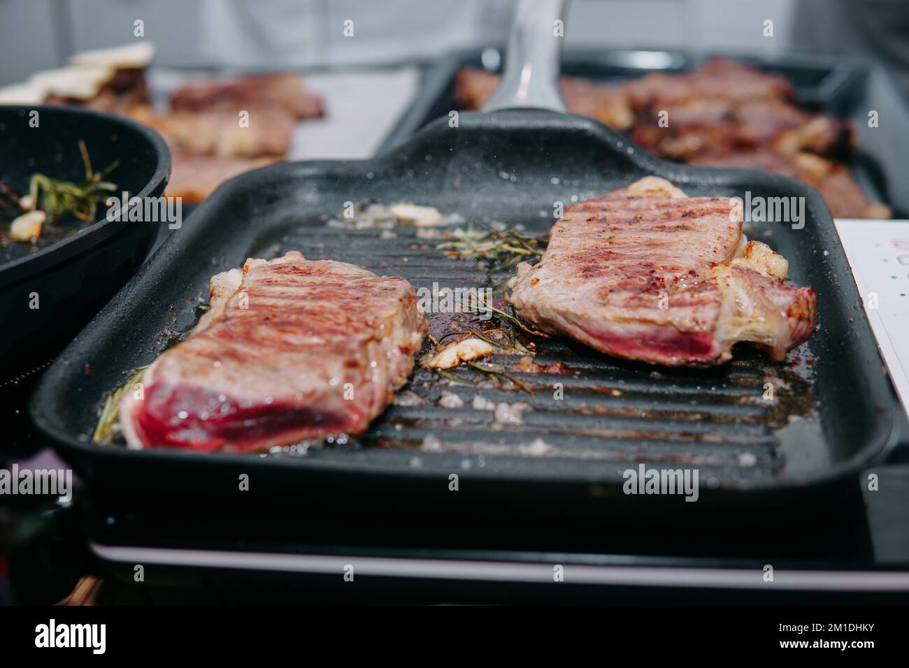 cooking steaks in a pan. cooking beef at the culinary master class. the ...