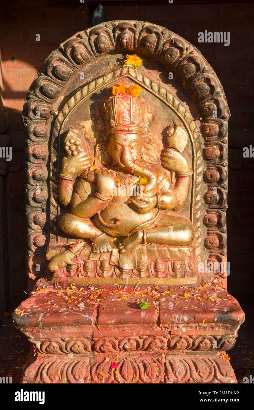 Ganesha shrine with brass image Stock Photo - Alamy