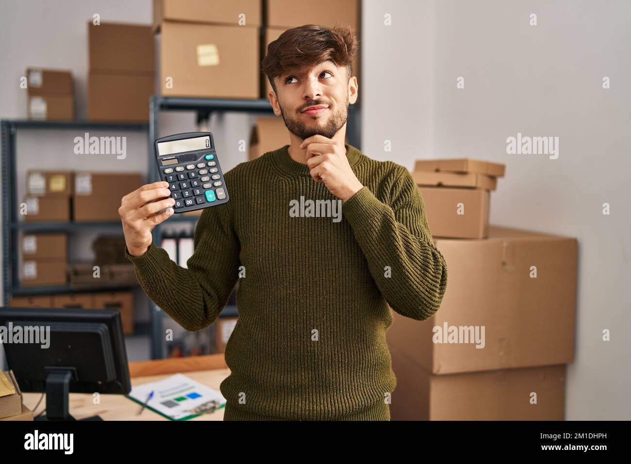 Arab man with beard working at small business ecommerce holding ...