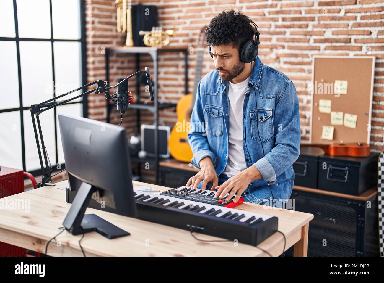 Arab male playing piano hi-res stock photography and images - Alamy